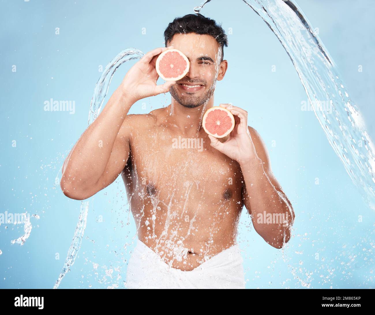 Skincare, beauty and water splash, man with fruit for vitamin c facial ...