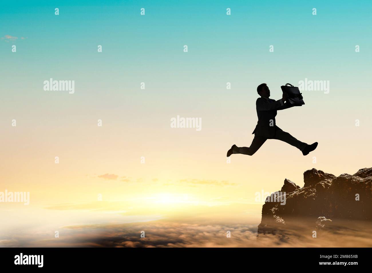 Businessman jump through the gap Stock Photo - Alamy