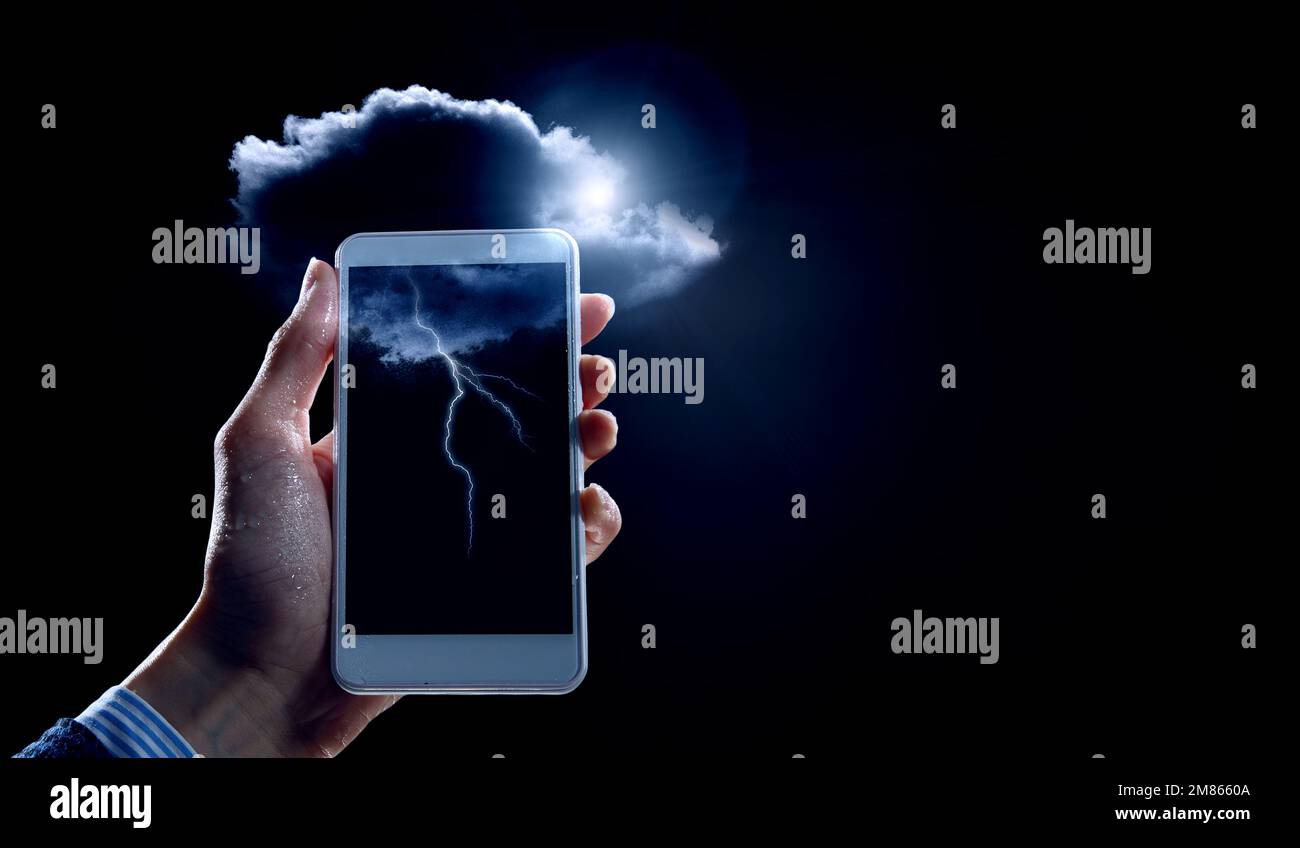 Thunderstorm with lightning on mobile phone screen Stock Photo - Alamy