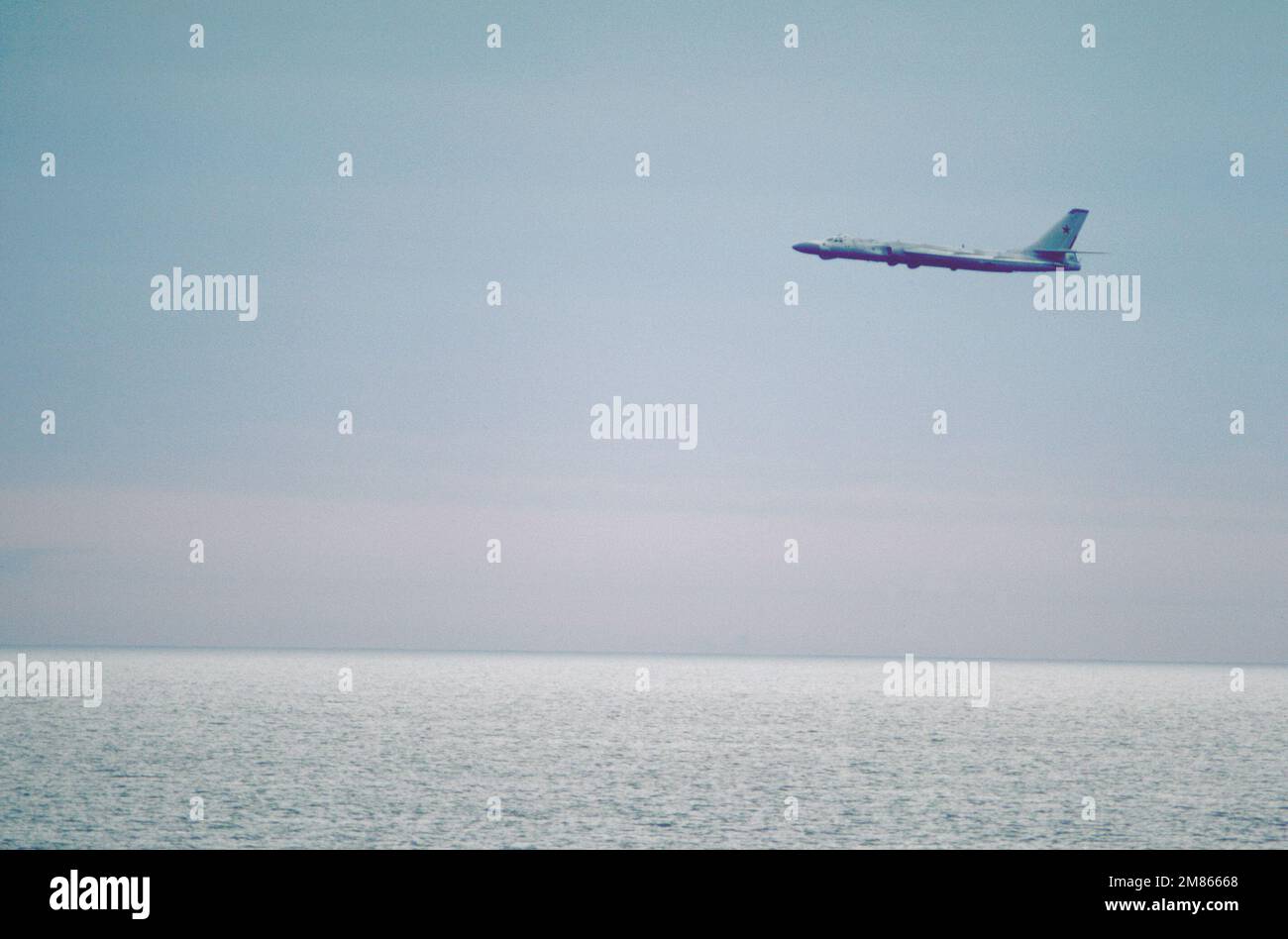 A Soviet Tu-16 Badger-D aircraft in flight while shadowing NATO forces ...