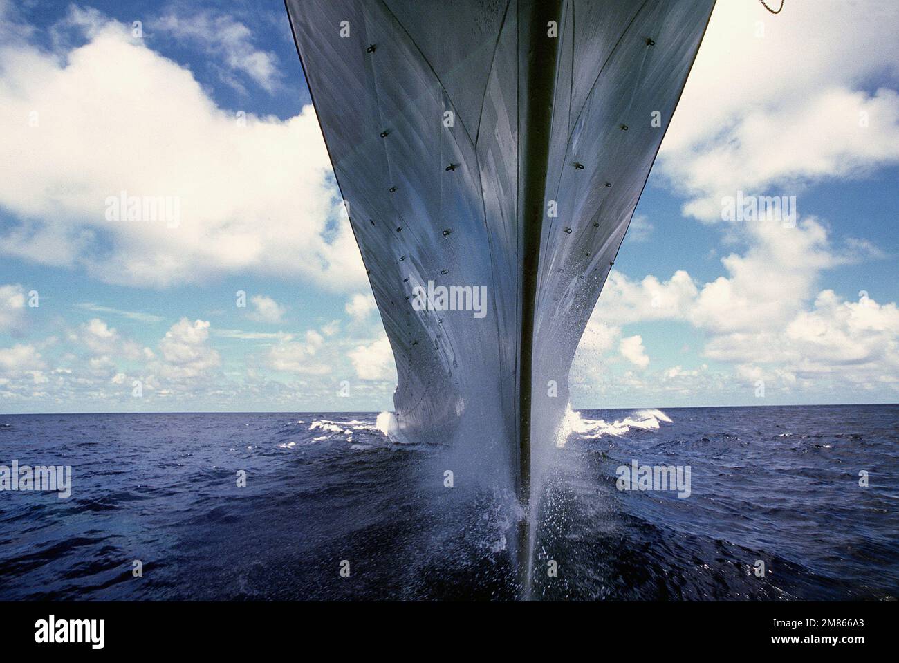 A water-level bow view of the battleship USS MISSOURI (BB-63) underway ...