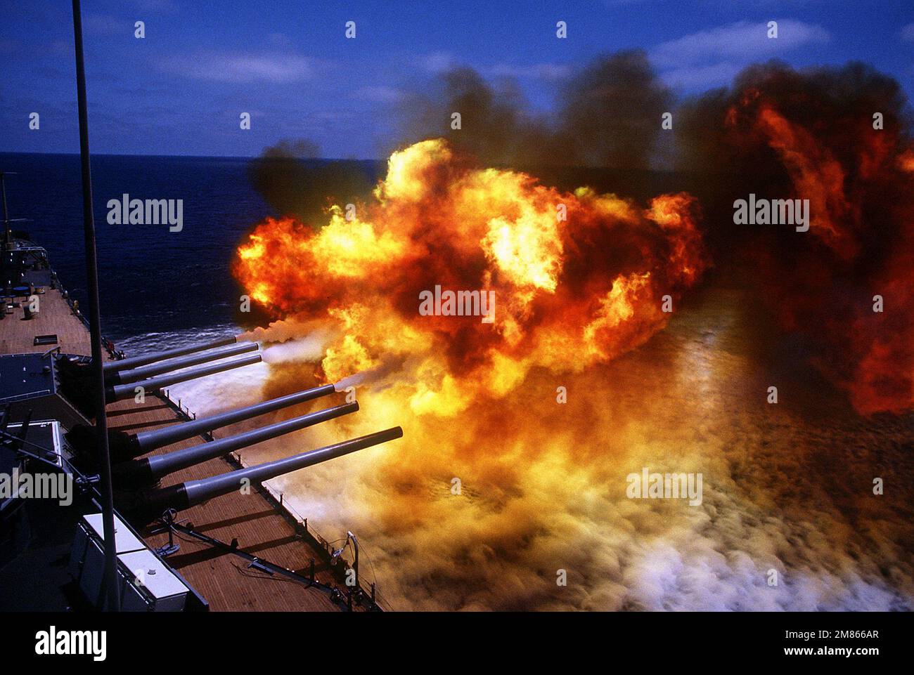 The No. 1 and 2 Mark 7 16-inch/50-caliber gun turrets are fired during ...