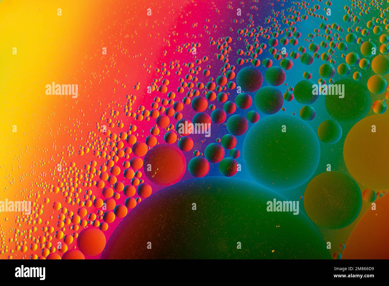 Macro photography of the oil drops on the water surface.Cosmic circles ...