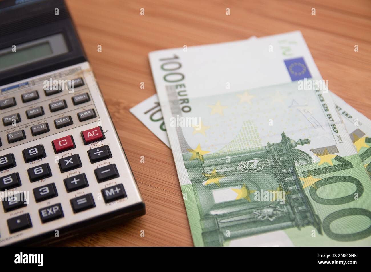 The table of someone who is doing accounts with the calculator next to ...