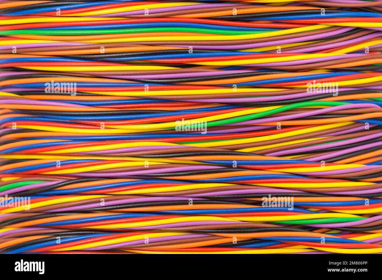 Close-up shot of multi-colored narrow gauge electrical wire wrapped ...