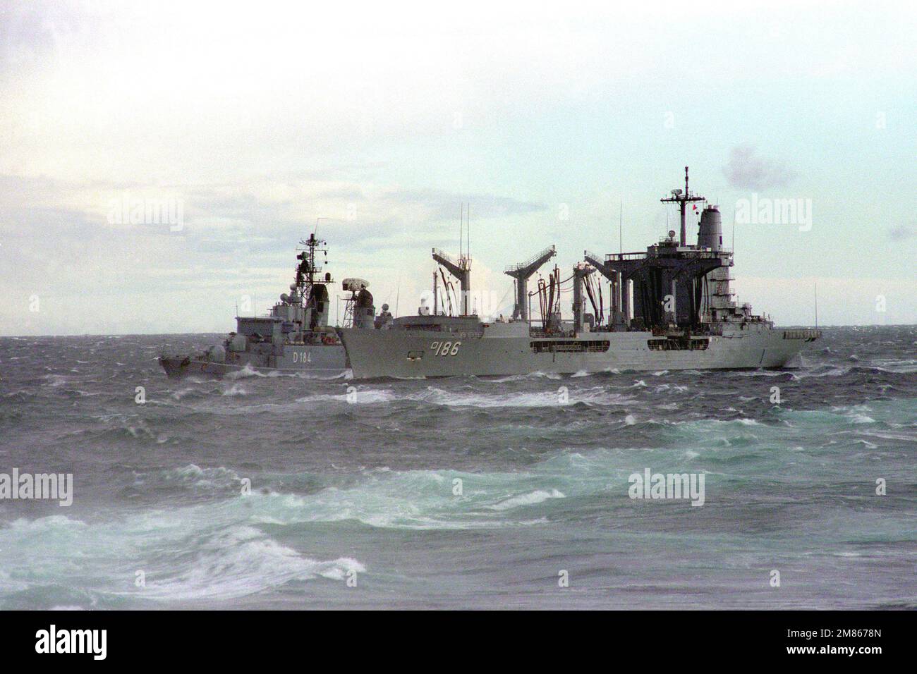 A port bow view of the oiler USS PLATTE (AO-186) refueling the West ...