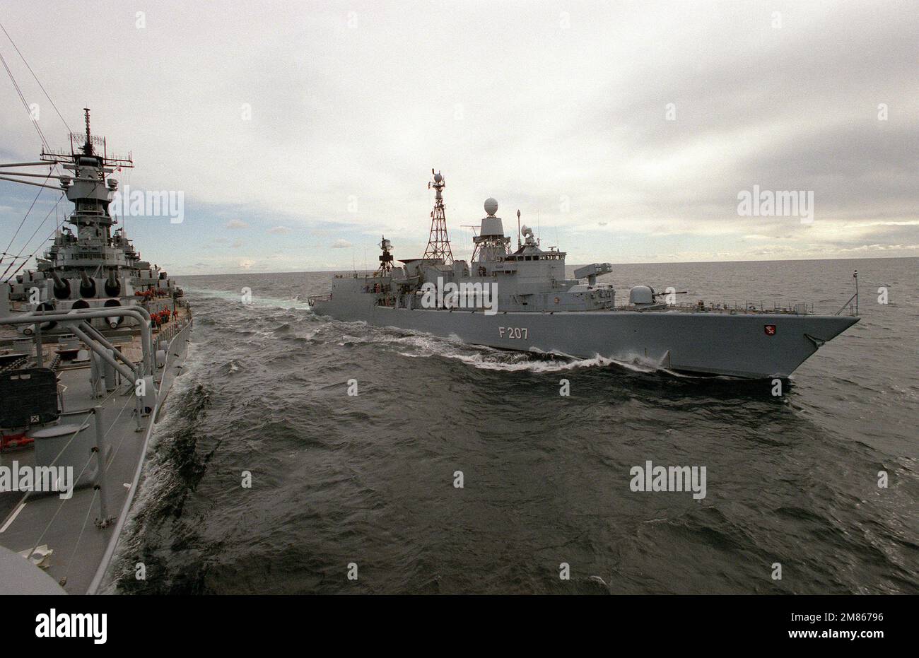 The West German frigate FGS BREMEN (F-207) pulls alongside the ...