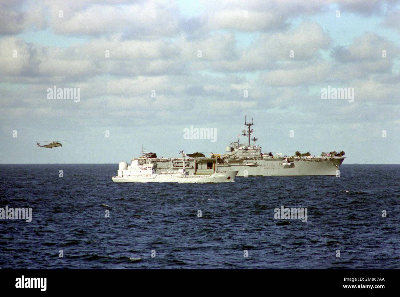 The East German intelligence ship JASMUND passes to starboard of the ...