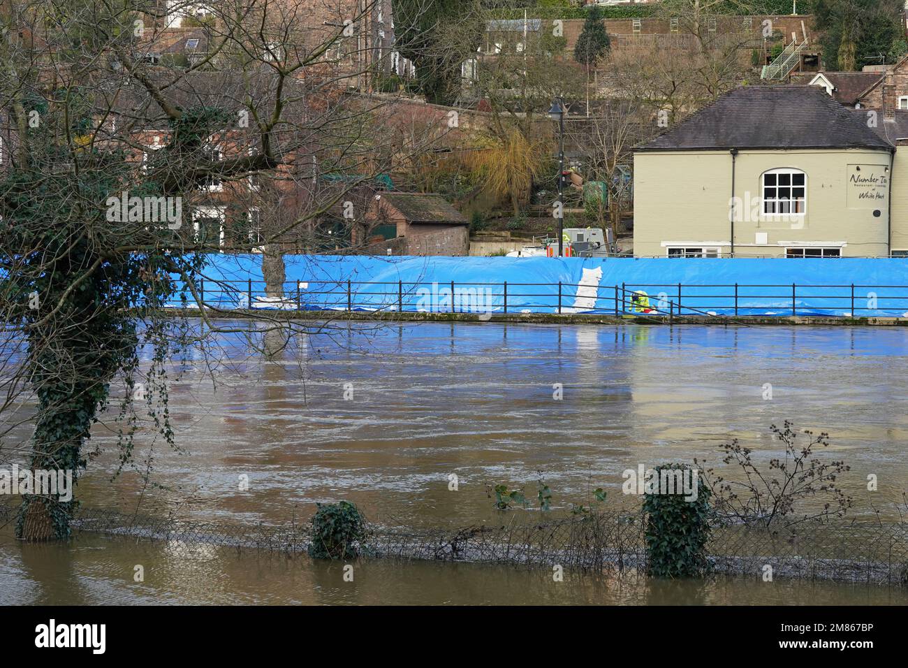 The Swollen River Severn As Flood Defenses Are Put In Place Along The