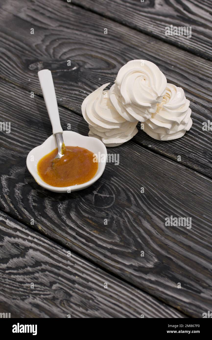 Homemade marshmallow. Apricot jam. On black boards. Close-up Stock ...