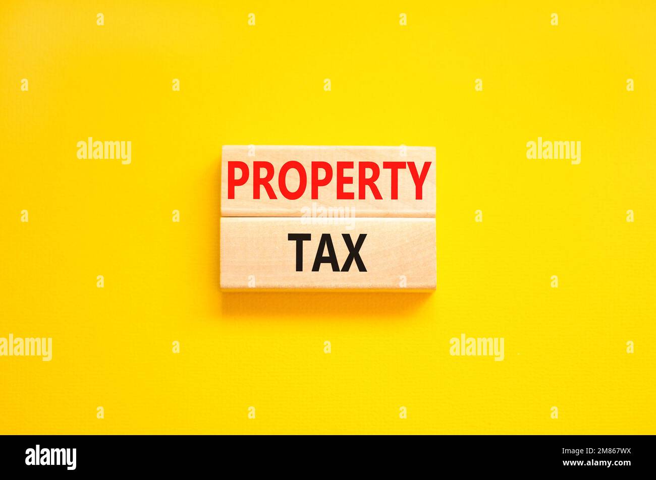 Property tax symbol. Concept words Property tax on wooden blocks ...