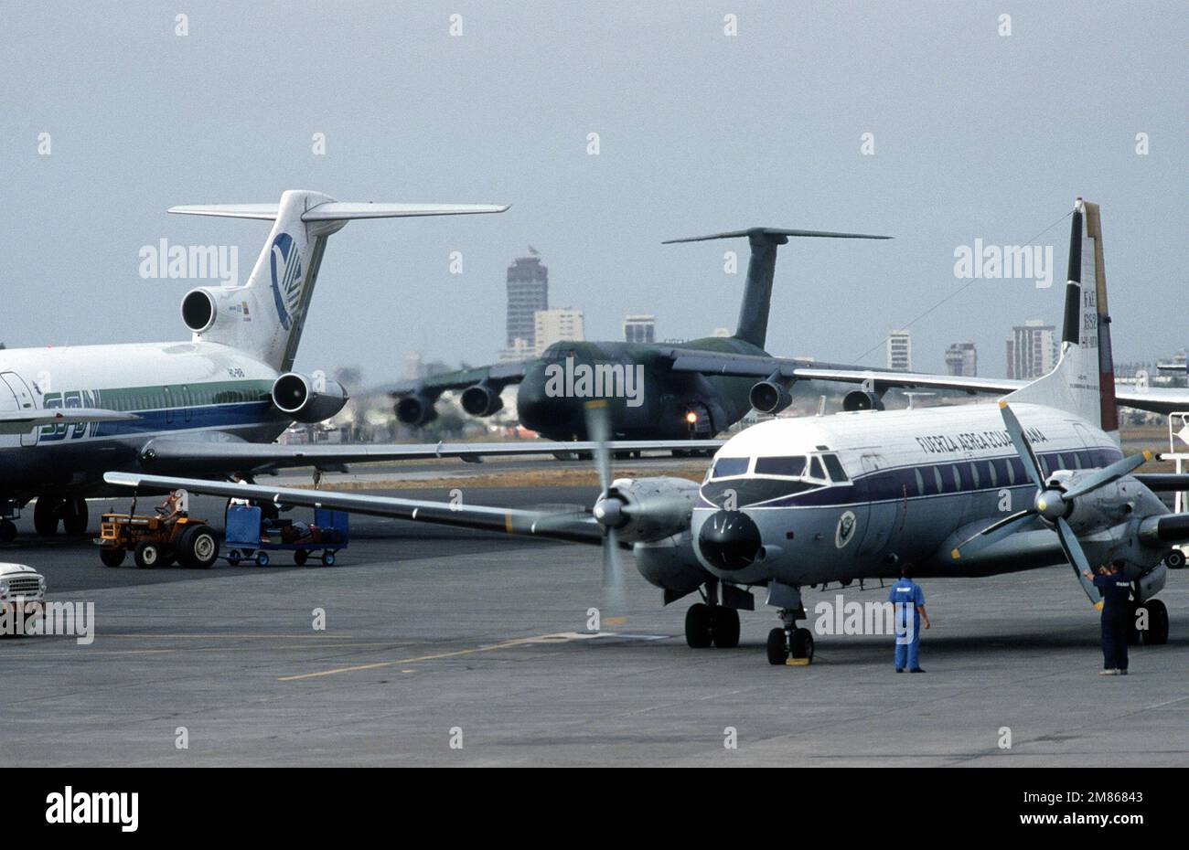 A Military Airlift Command C-5A Galaxy aircraft, center background ...