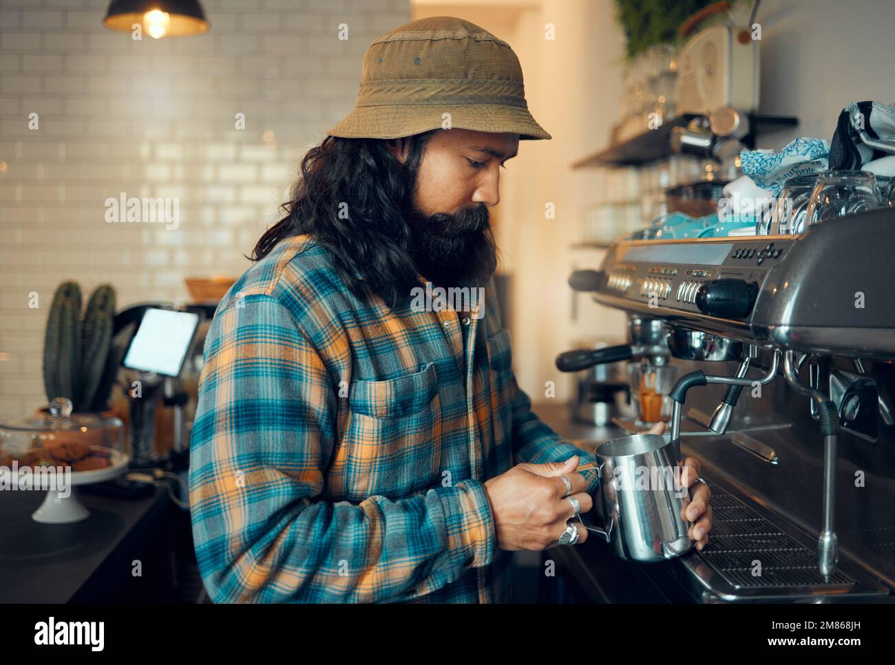 Cafe worker, coffee shop barista and man work on espresso machine in a ...