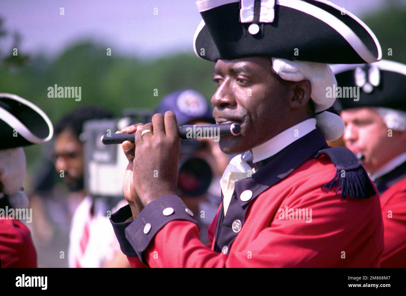 A close-up of a Colonial fife player participating in a parade ...