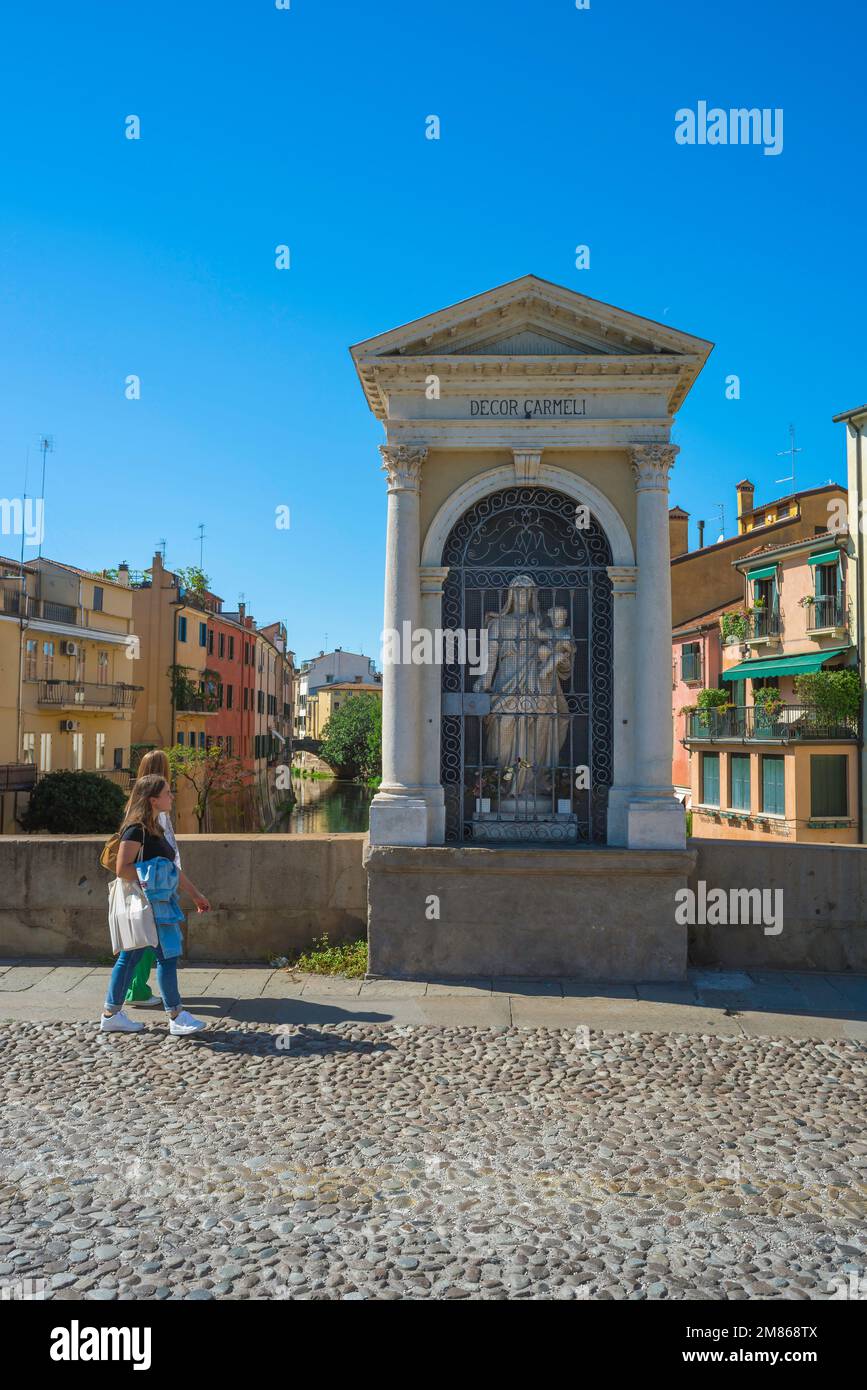 Christianity Europe, view of young Italian women passing a Madonna And ...