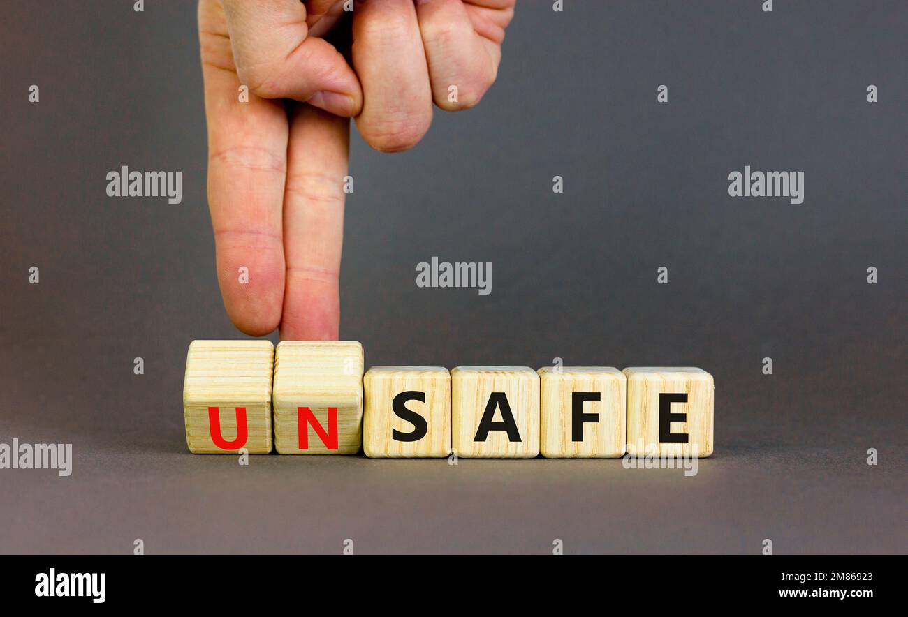 Safe or unsafe symbol. Concept word Safe Unsafe on wooden cubes ...