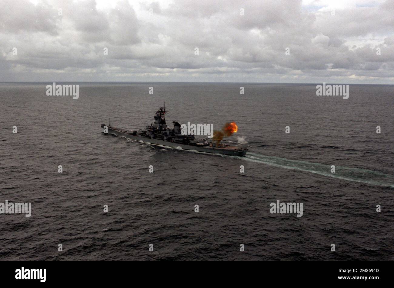 An aerial port quarter view of the battleship USS IOWA (BB-61 ...