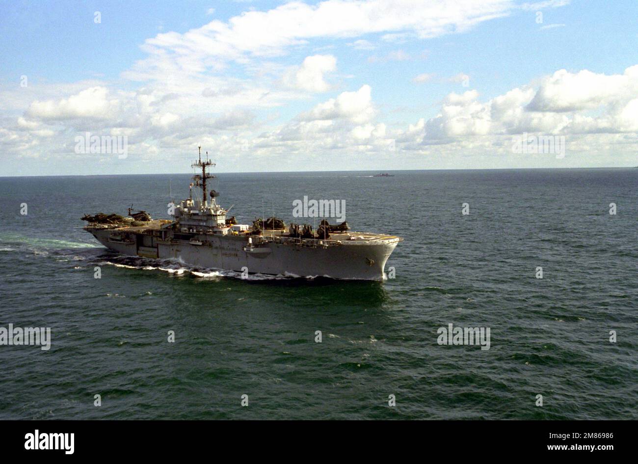 A starboard bow view of the amphibious assault ship USS INCHON (LPH-12 ...