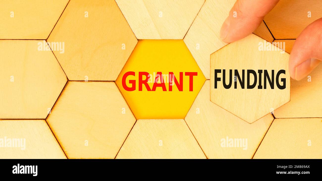 Grant funding symbol. Concept words Grant funding on wooden puzzles ...