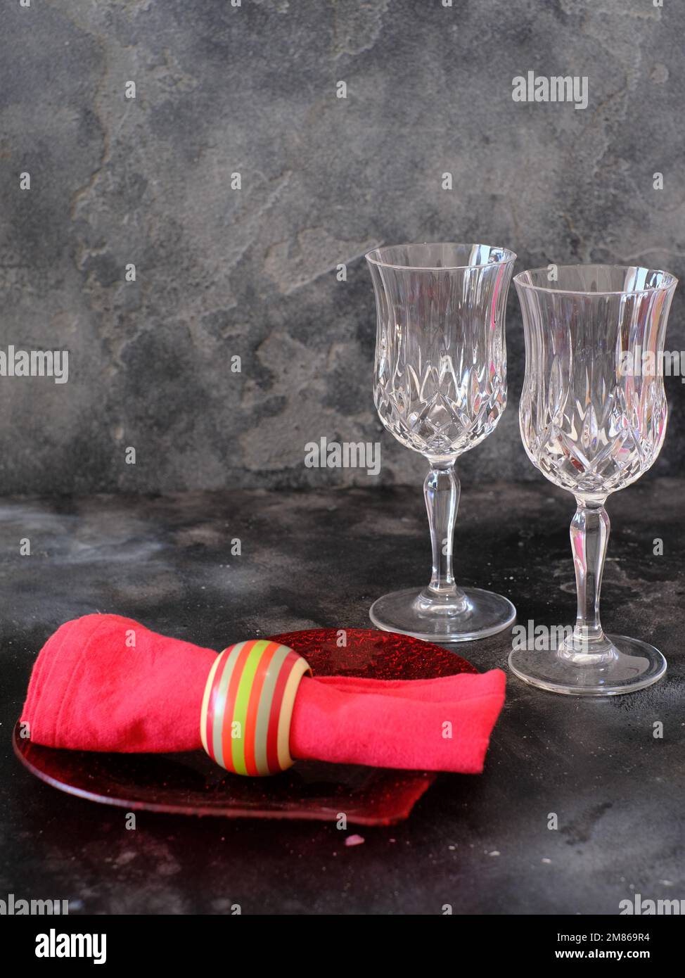 Two beverage glasses with a red napkin on a dark background Stock Photo ...