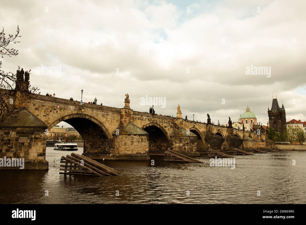 A scenic view of the mediaeval Charles bridge above the tranquil Vltava ...