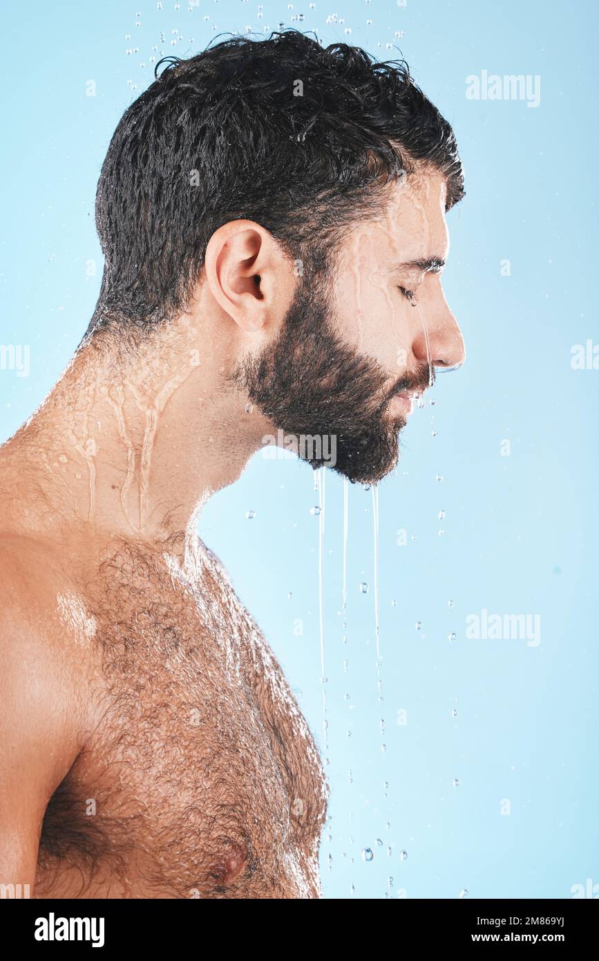 Water drops, face and man in shower for skincare, cleaning body and hygiene grooming against ...