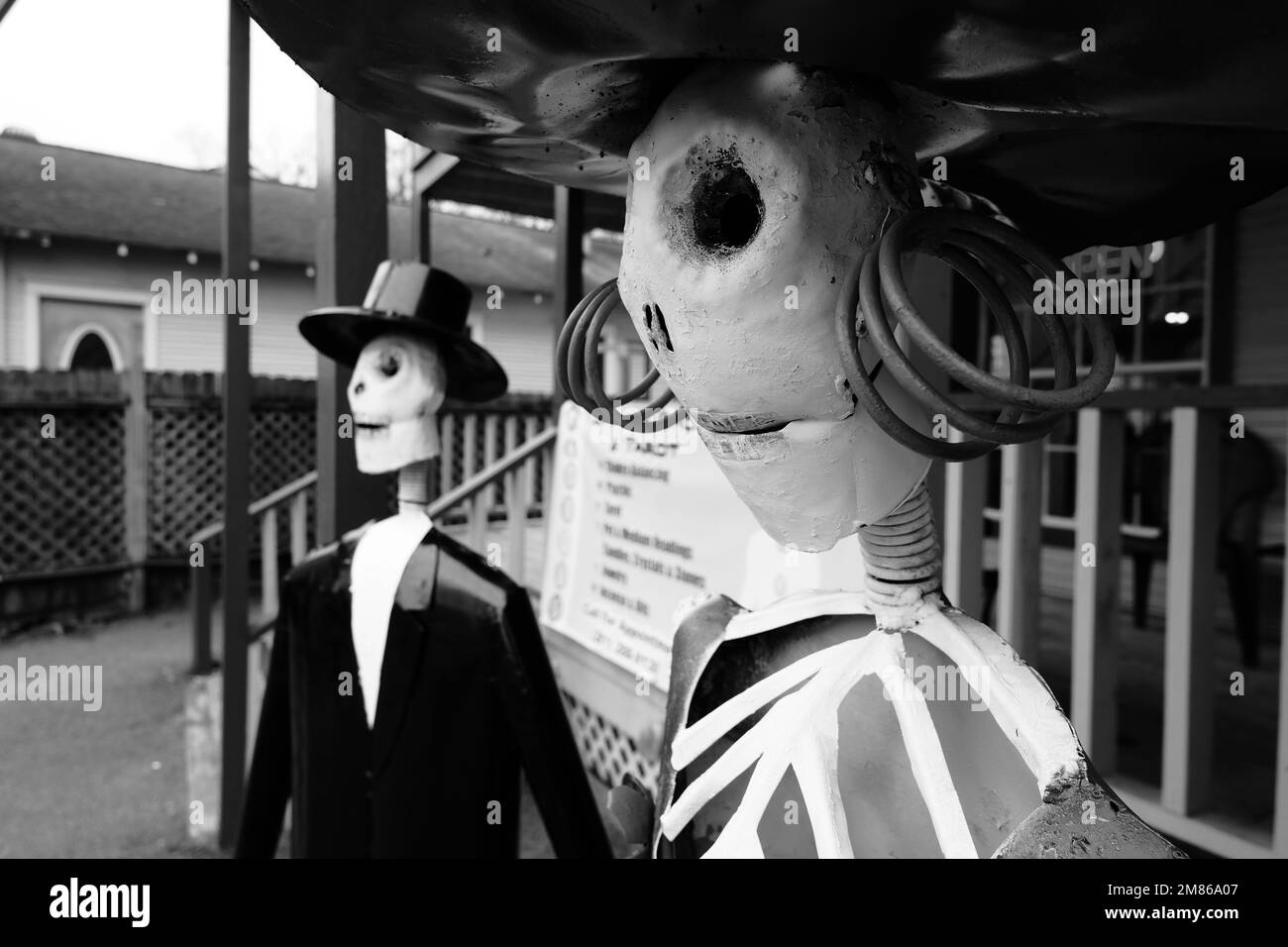 Groom and bride skeleton sculptures with big hats outdoors Stock Photo ...