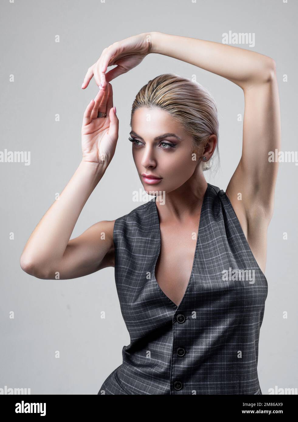 Pretty girl holding arms up showing smooth underarms. Underarm hair ...