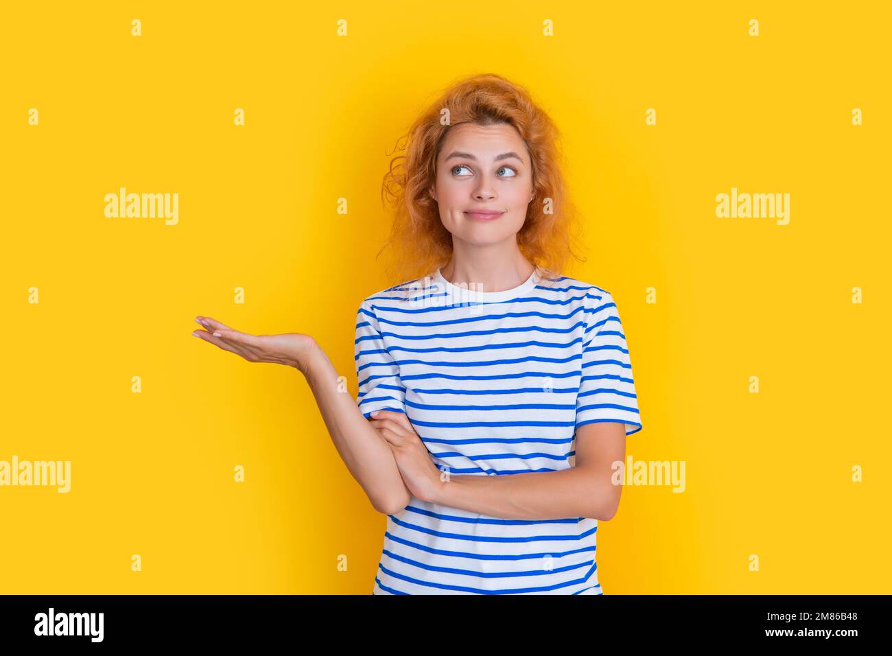 Redhead Woman Portrait Presenting Product Isolated On Yellow Background Portrait Of Woman Stock