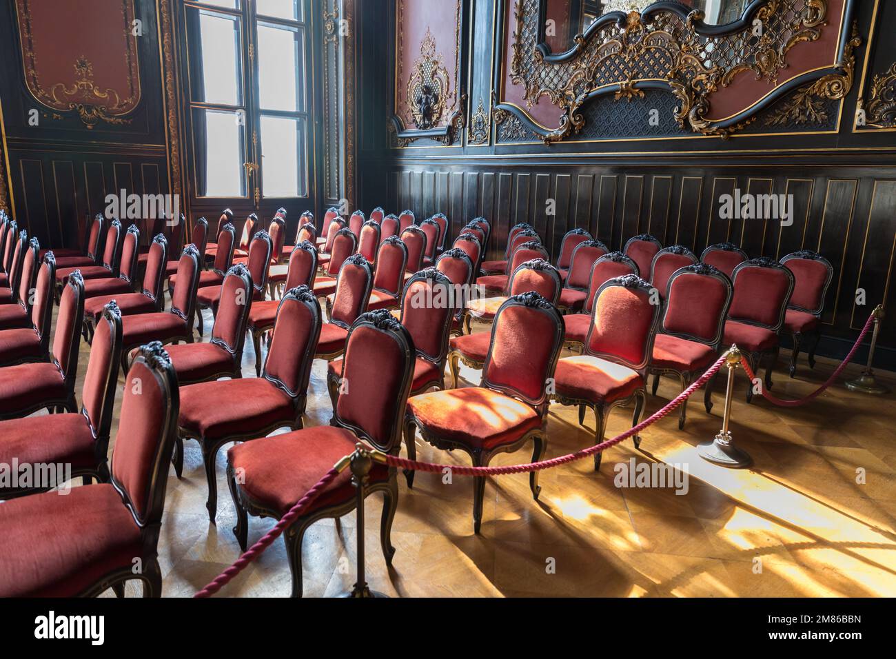 Empty classical music concert hall, stylish chairs and a large crystal ...