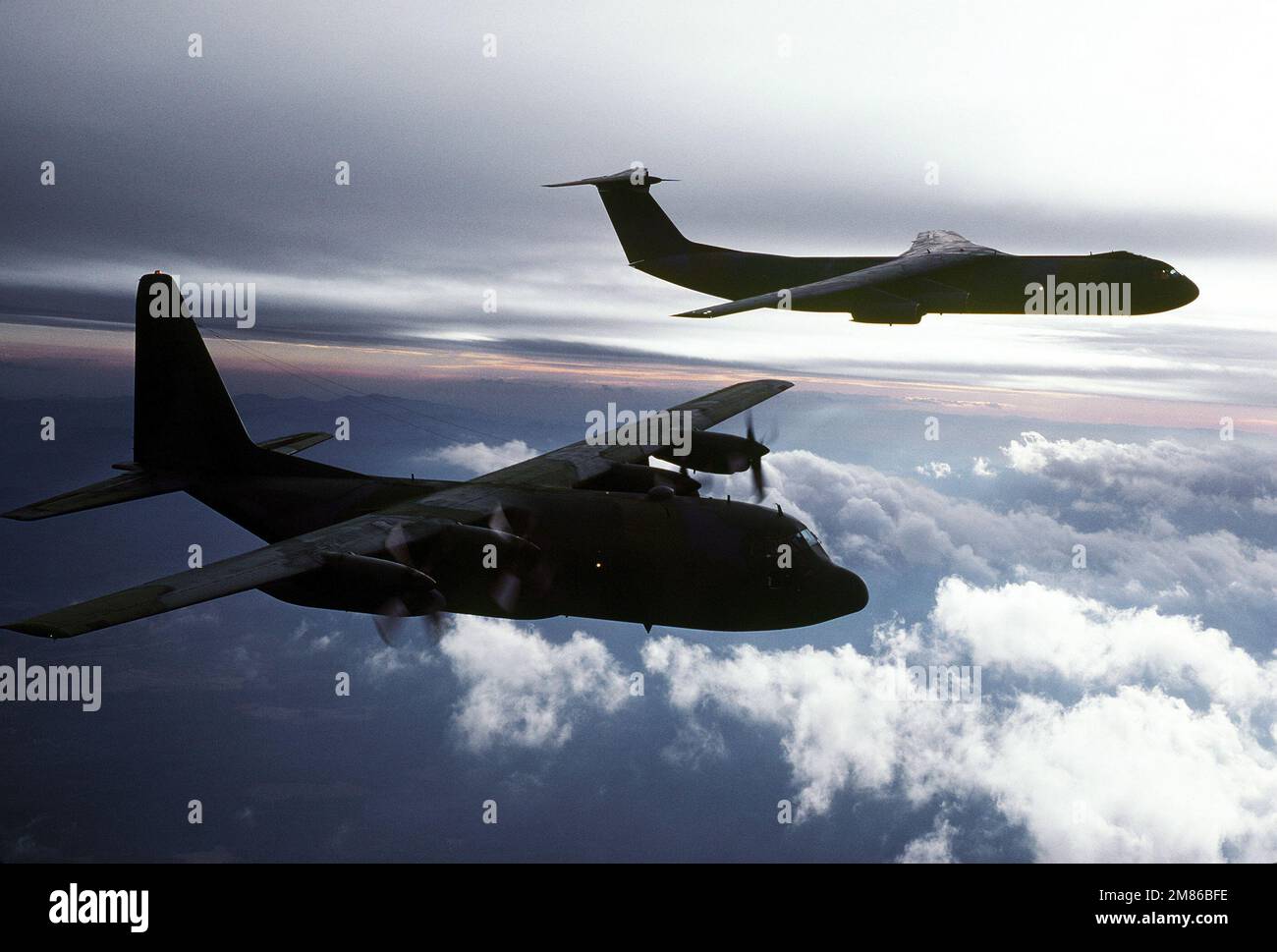 Air to air side view of Air Mobility Command's 62nd Airlift Wing ...