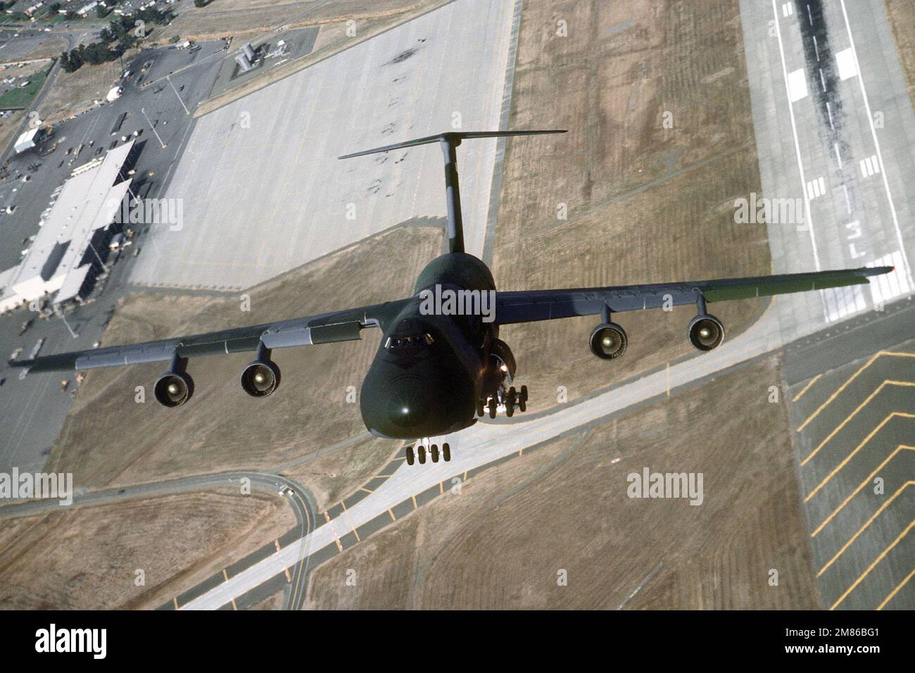 Air to air front view of a Air Mobility Command's 60th Military Airlift ...