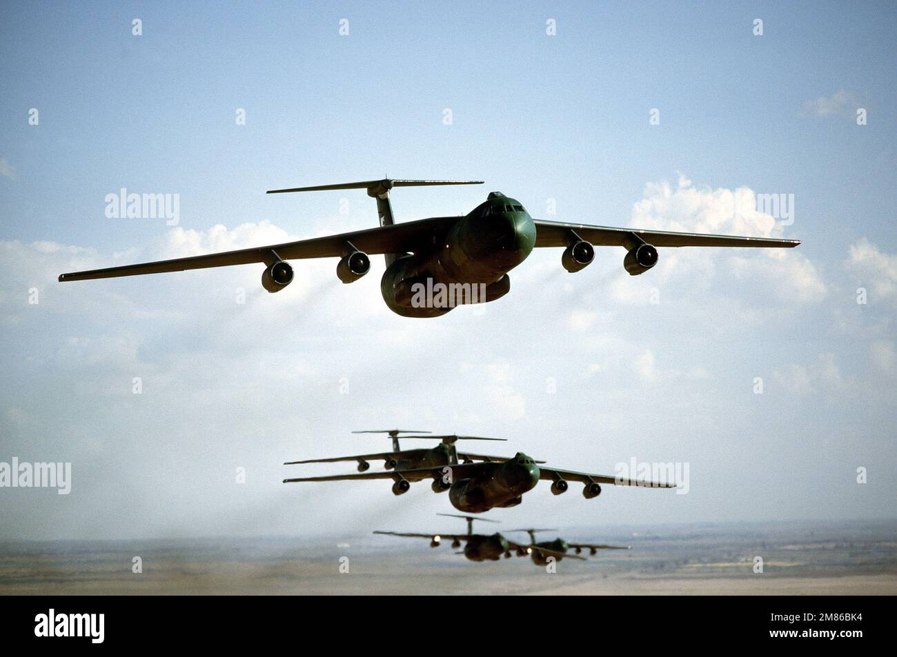 Air to air front view of five C-141 Starlifters, assigned to the 63rd ...