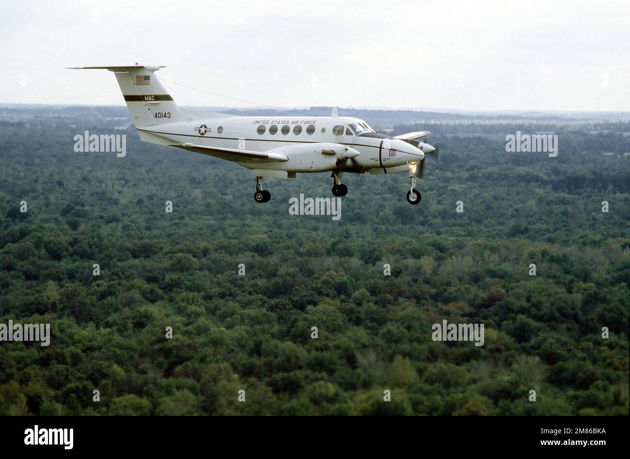 Air to air side view of a Air Mobility Command's 375th Military Airlift ...