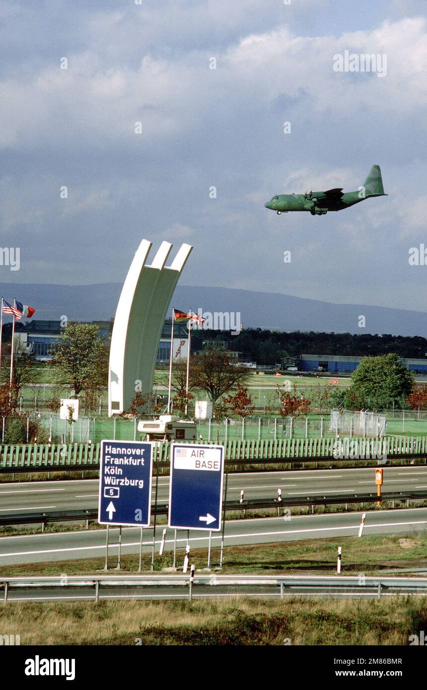 A C-130 Hercules comes in for a landing, flying past the Berlin Airlift ...