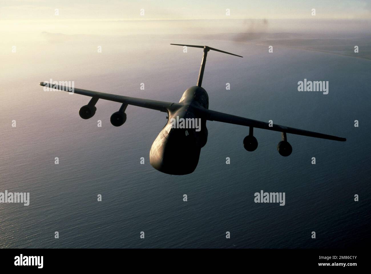 Air to air front, backlighted, view of Air Mobility Command's 60th ...