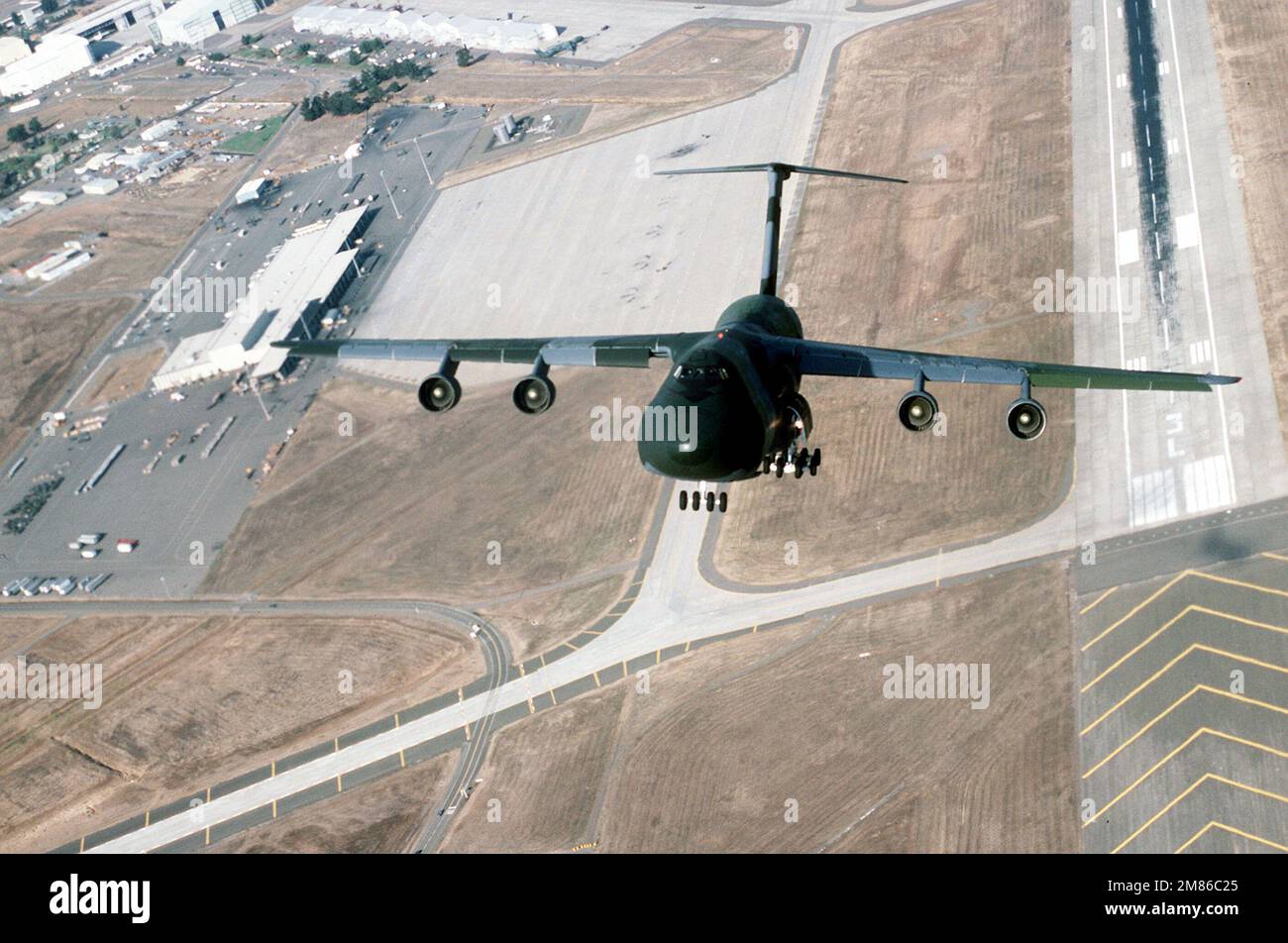 Air to air front view of a Air Mobility Command's 60th Military Airlift ...