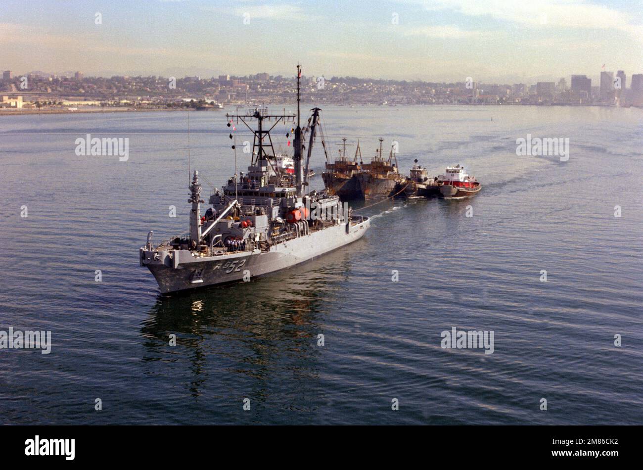 A port bow view of the salvage ship USS SALVOR (ARS-52) underway with ...
