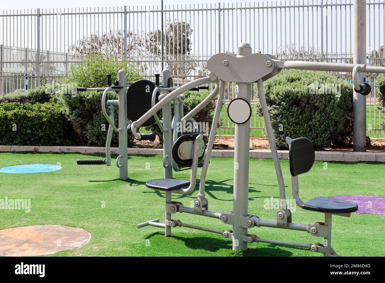 Modern exercise equipment on sport ground Stock Photo - Alamy