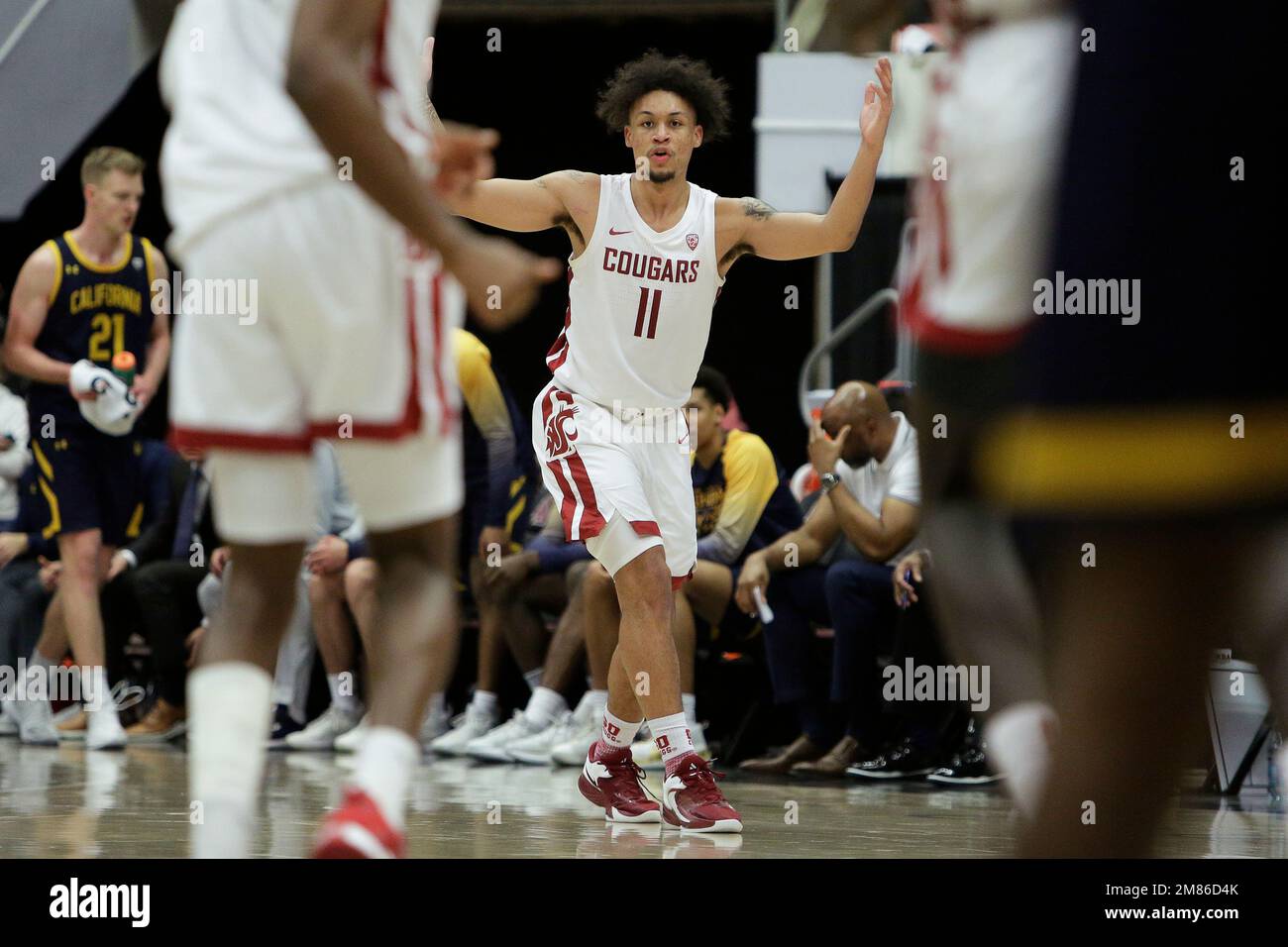 Washington State forward DJ Rodman, center, celebrates his basket ...