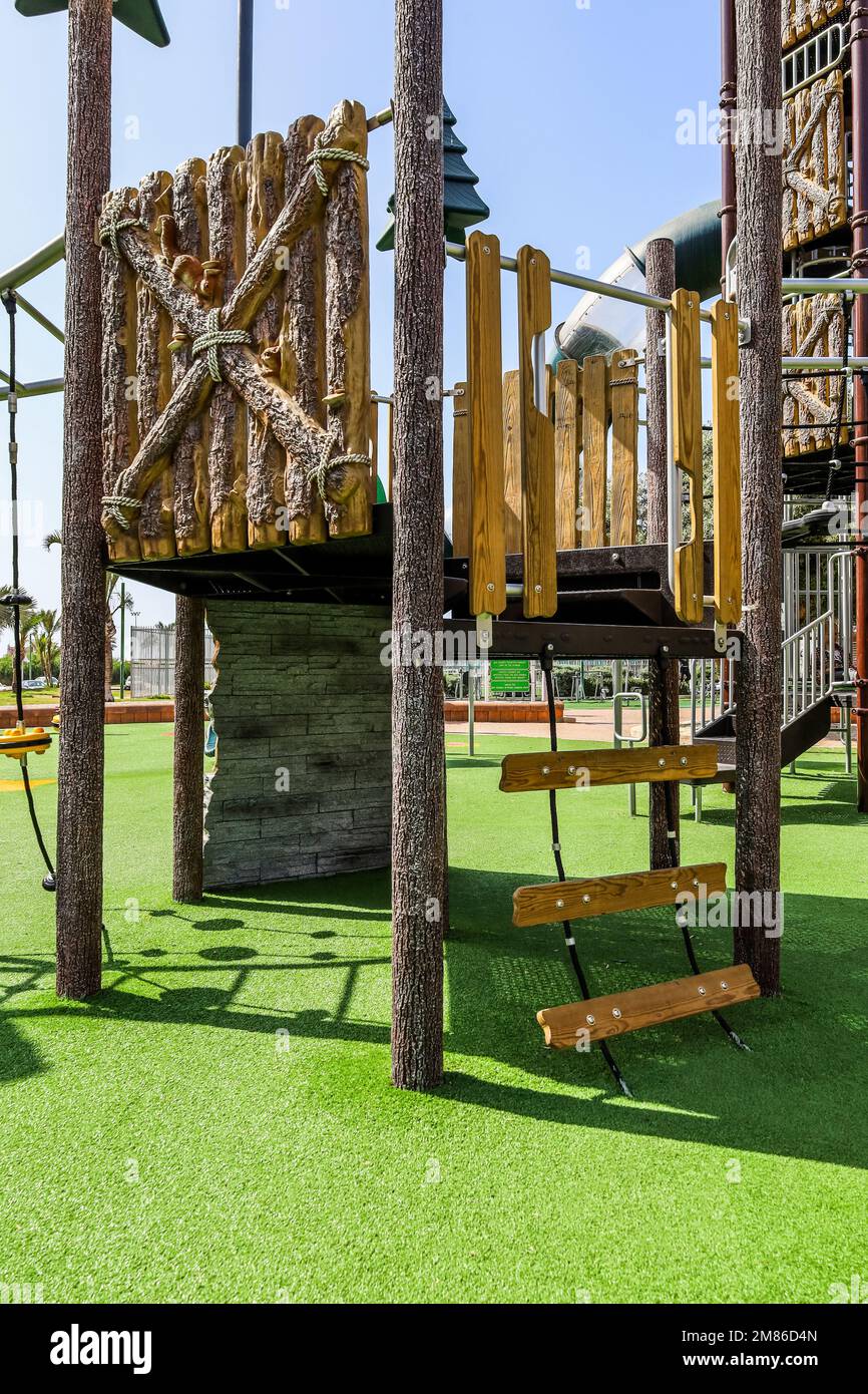View of children's complex with ladder on playground Stock Photo - Alamy