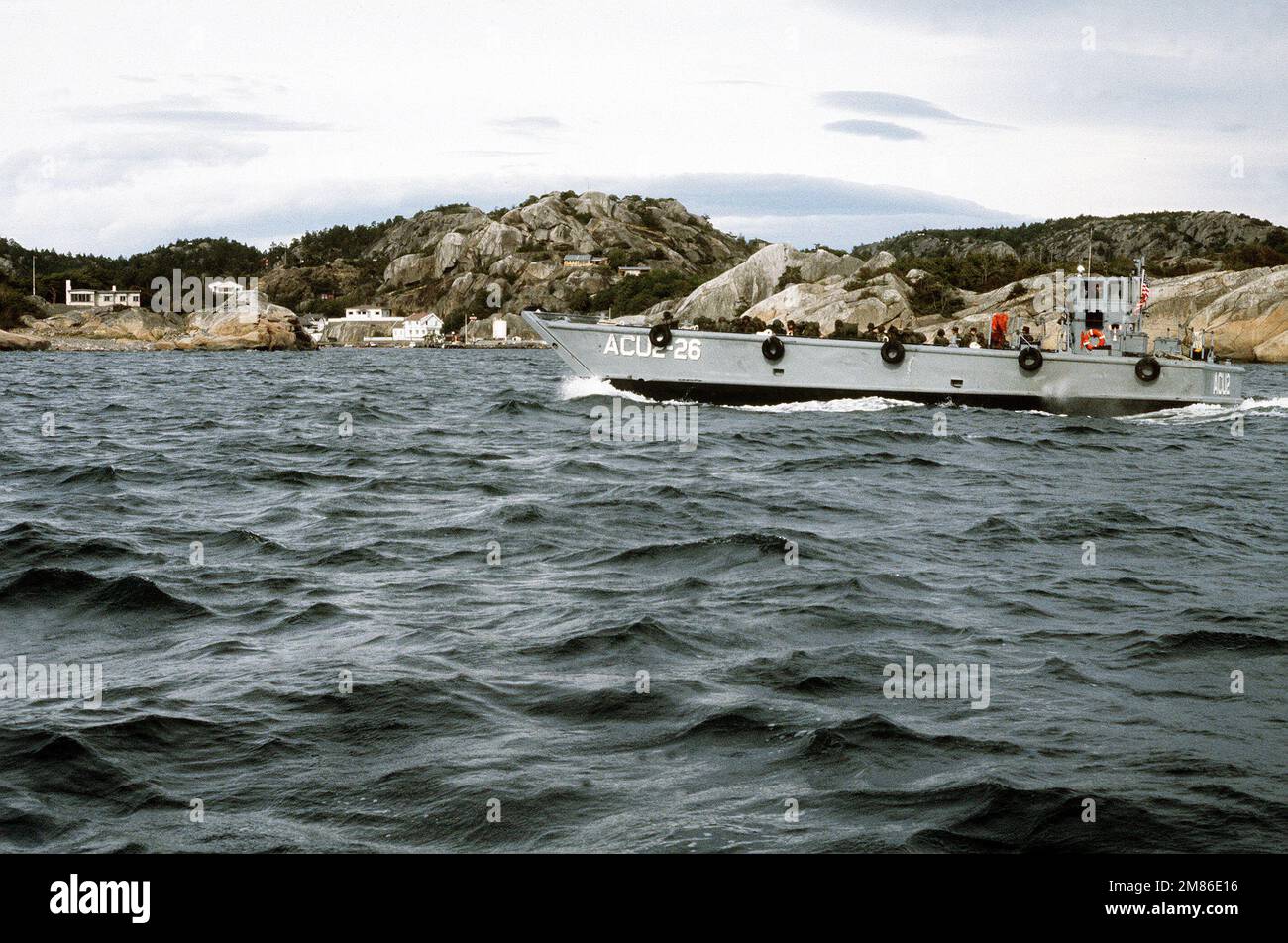 Assault Craft Unit 2 (ACU-2) carrying troops approaches a beachhead ...