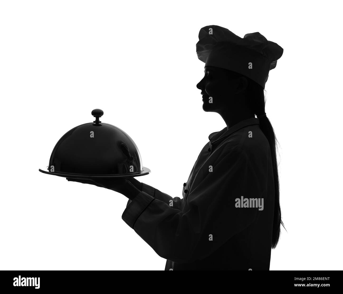 Silhouette of female chef with cloche on white background Stock Photo ...