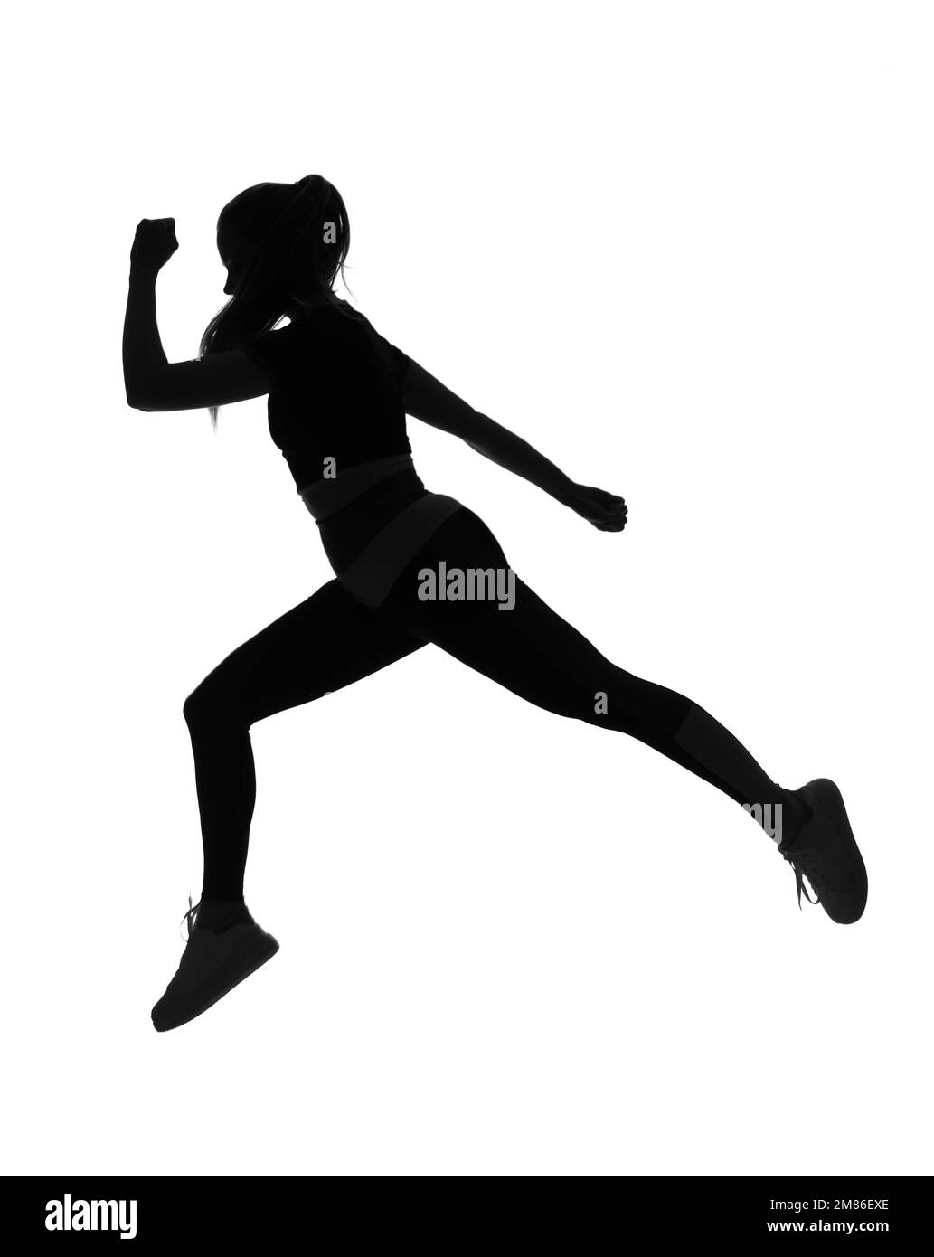 Silhouette of sporty young woman running on white background Stock ...
