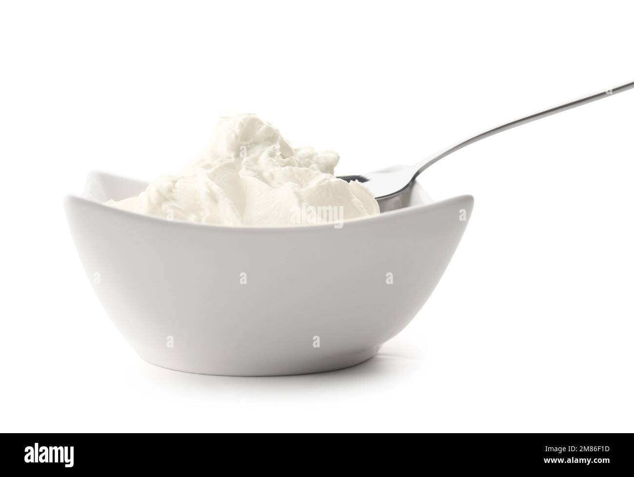 Bowl of delicious cream cheese on white background Stock Photo - Alamy