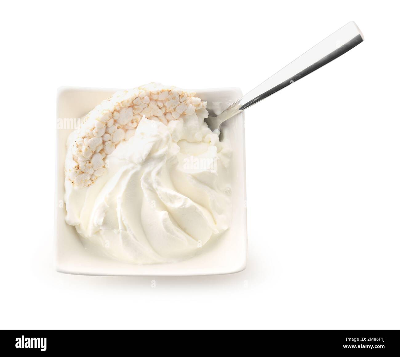 Bowl of delicious cream cheese on white background Stock Photo - Alamy