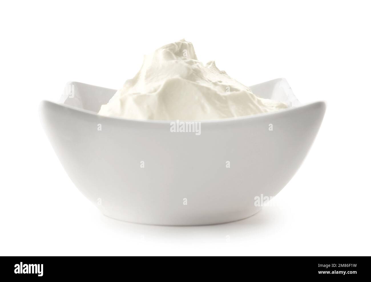 Bowl of tasty cream cheese isolated on white background Stock Photo - Alamy