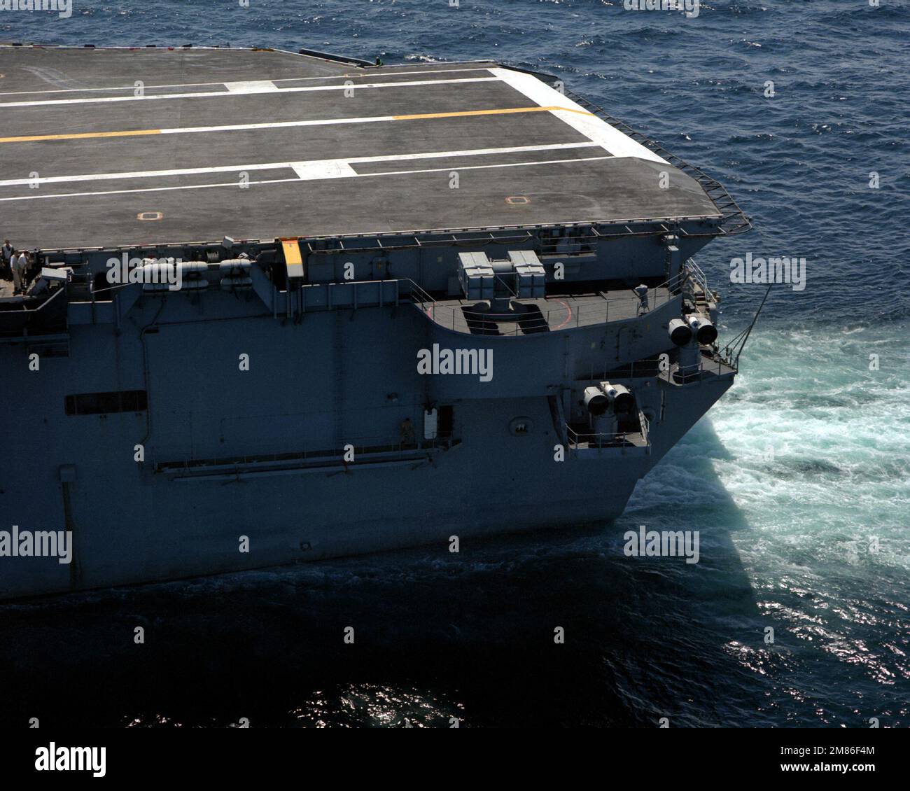A port view of the stern of the nuclear-powered aircraft carrier USS NIMITZ (CVN-68) showing ...
