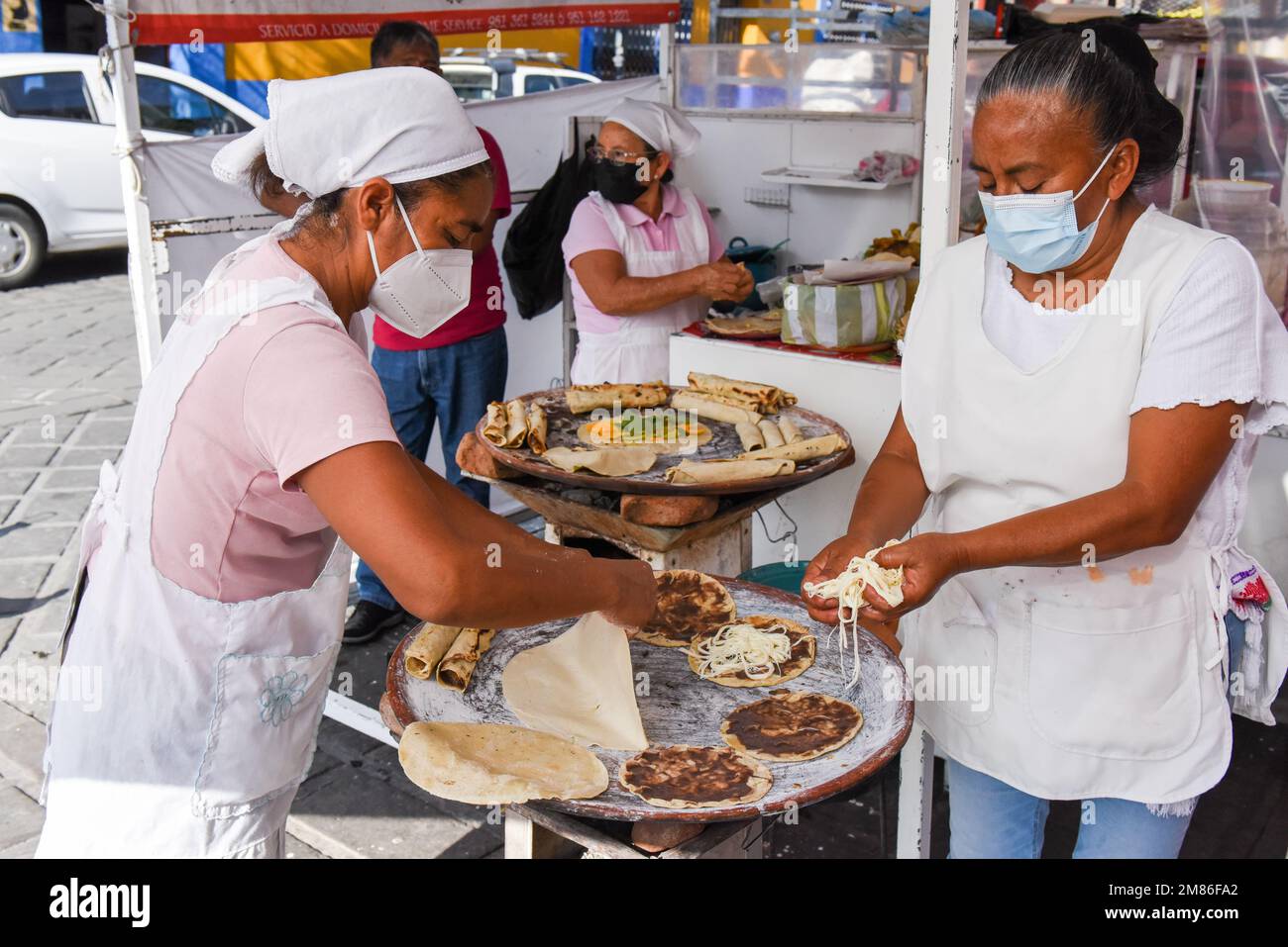 Women working at a food stall selling Tlayudas, Oaxaca Mexico Stock Photo - Alamy