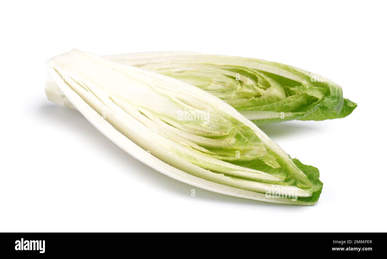 Halves of fresh endive isolated on white background Stock Photo - Alamy